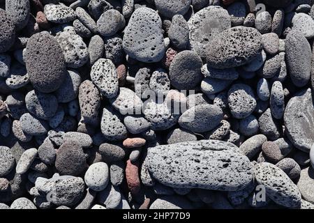 Overhead view of rounded lava rocks on the beach of Kona, Hawaii, great ...