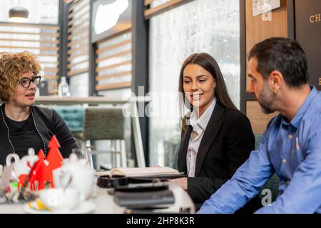 Amazing and beautiful business people are discussing about the company ...