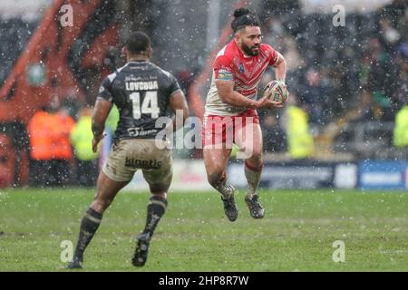 Konrad Hurrell #23 of St Helens looks to offload the ball to Tommy ...