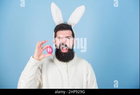 Grinning bearded man wear silly bunny ears. Easter symbol concept ...