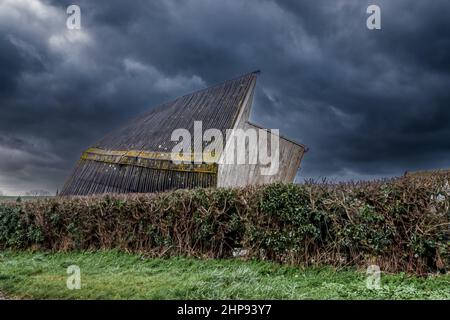 wooden horse stables blown over on to its side strong winds of a storm ...