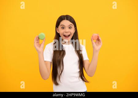 amazed kid hold french macaron or macaroon cookies, sweet life ...