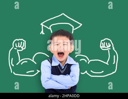 Strong kid in graduation cap with muscles on chalkboard background ...
