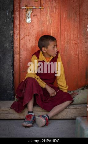 Young lama outside key monastery, Spiti Valley, Himachal Pradesh, India ...