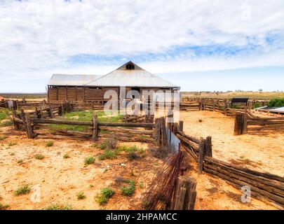 Mungo sheep shed with sheep yard wooden fenced paddock in arid dry ...
