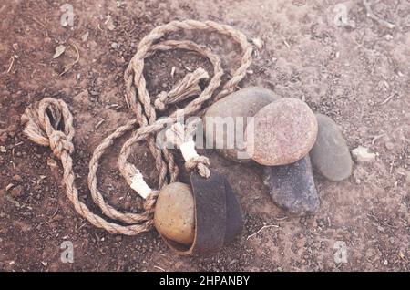 Sling of David with Five Smooth Stones and Goliaths Sword in the Dirt ...