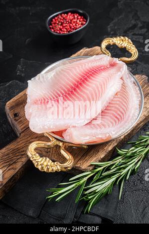 Raw tilapia fish ready for cooking Stock Photo - Alamy