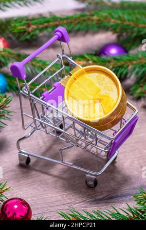 Trolley with Christmas decorations. Branches of a Christmas tree. Cart ...
