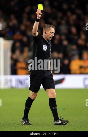 Referee Chris Kavanagh shows a yellow card to Newcastle United's Bruno ...