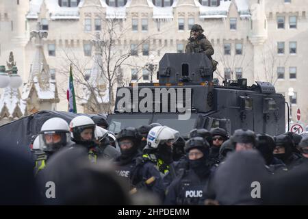 A police officer in an armored vehicle patrols a gang-controlled area ...