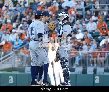Rice catcher Justin Long (30) warms up between innings against Texas ...