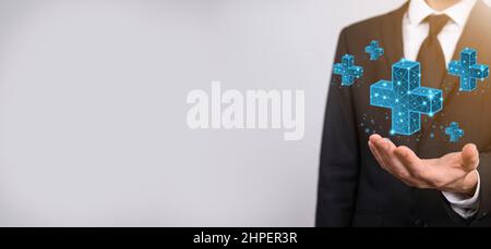 Businessman hand holding 3D plus low polygonal icon.Plus sign virtual ...