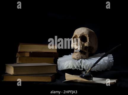 Books with a quill, inkwell, skull and ruff. world literature concept ...