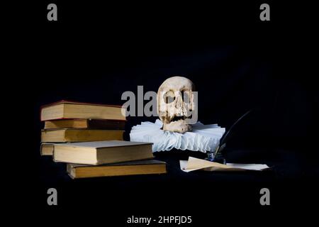 Books with a quill, inkwell, skull and ruff. world literature concept ...