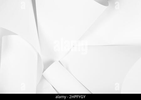 White sheets of office paper are twisted and scattered. Paper white ...