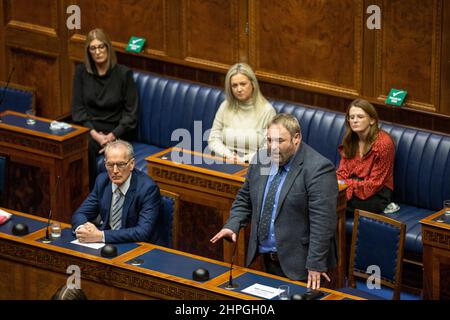 Sinn Fein MLA Colm Gildernew (centre) puts a question to Neil Gibson ...