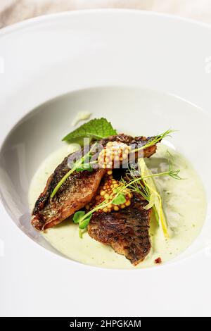 Vertical shot of fried seafood with vegetables on a white plate Stock ...