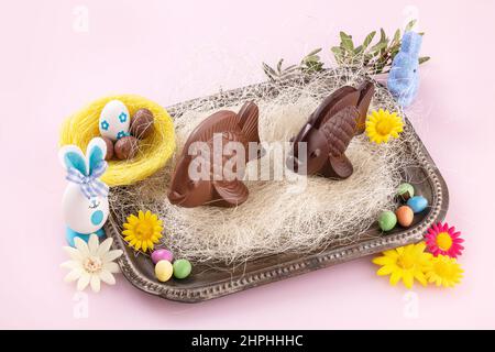 Delicious Easter chocolate assortments on a pink table Stock Photo - Alamy