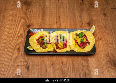 Mexican food Trompo Pastor tacos al pastor, beef stacked in sauce with ...