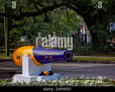 A Civil War cannon is painted for Mardi Gras on Government Street, Feb ...