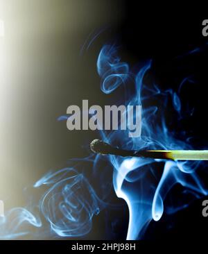 Color smoke from match on dark background Stock Photo - Alamy