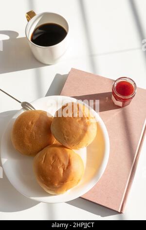 relax cozy objects and background with bread, coffee, candle, a book ...