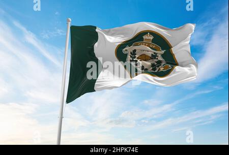 flag of Kitchener, Ontario , Canada at cloudy sky background on sunset ...
