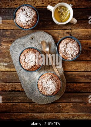 Choco pies served in singular cup outside in wood table, stone tray ...