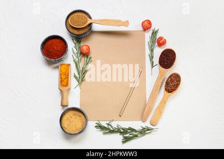 Composition with blank sheet of paper and spices on light background ...