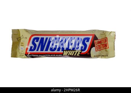 Snickers chocolate bar on white background with open cut up bar by the ...