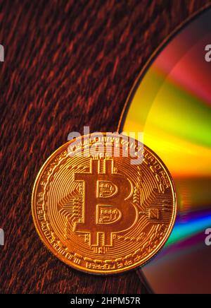 Bitcoin coin on a CD - DVD, background for design Stock Photo - Alamy