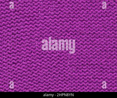 Handmade lilac purple colored knitted wool scarf texture. Winter violet ...