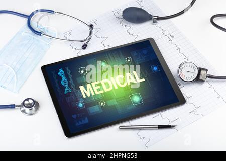Tablet pc and medical stuff Stock Photo - Alamy