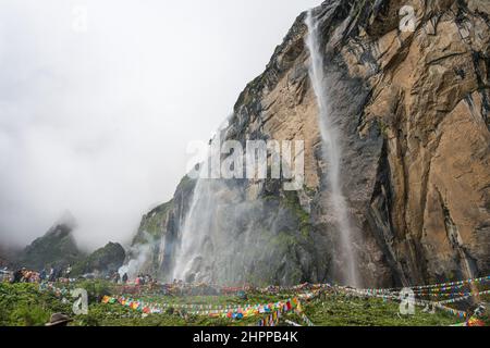 YUBENG, CHINA - Holy Waterfall at Yubeng Village. a famous landscape in ...