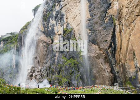 YUBENG, CHINA - Holy Waterfall at Yubeng Village. a famous landscape in ...