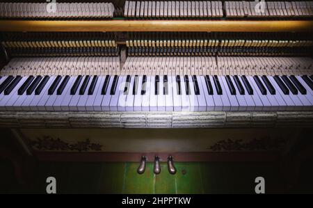 Details of an open upright piano, strings and structure closeup view ...