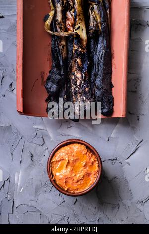 high angle view of some roasted calcots, sweet onions typical of ...