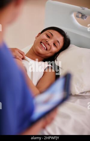Asian adult female medical professional writing in journal notebook ...