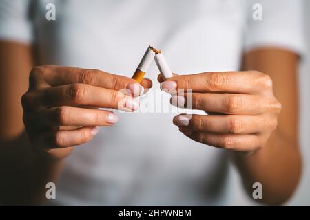 No smoking. Woman stop smoke, refuse, reject, destroy, smash cigarette ...