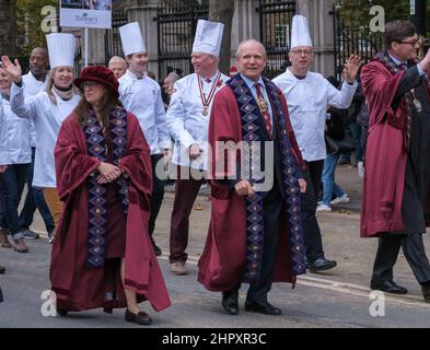 Modern Livery Companies march in ceremonial robes holding signs in the ...