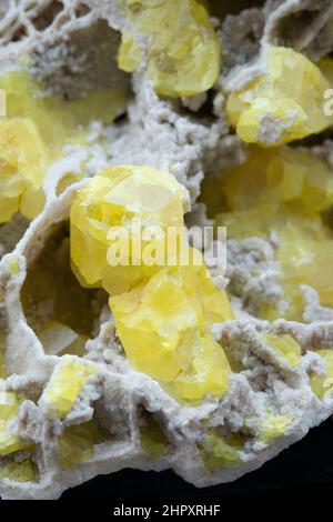 rough crystal of sulphur stone on white marble Stock Photo - Alamy