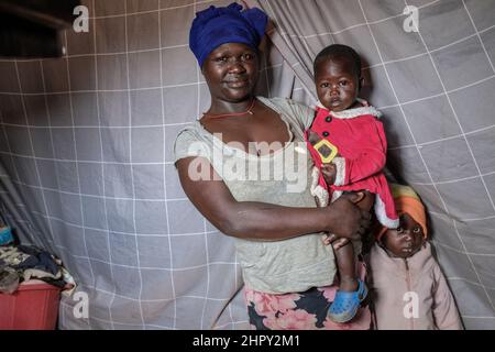 A portrait of 22 year old Elpha Atieno during a food drive in Kibera ...