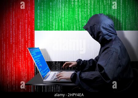 Anonymous hooded hacker, flag of United Arab Emirates, binary code ...