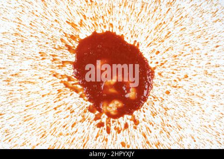 Passata tomato sauce splattered in a mess on a white background Stock ...