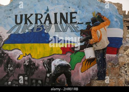Binnish, Syria. 24th Feb, 2022. Syrian painters draw a mural in ...