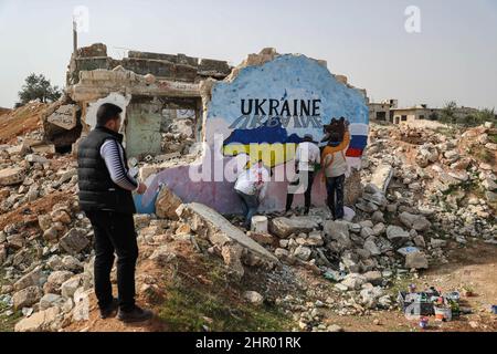 Binnish, Syria. 24th Feb, 2022. Syrian painters draw a mural in ...