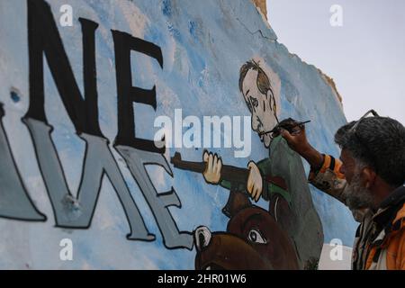 Binnish, Syria. 24th Feb, 2022. Syrian painters draw a mural in ...