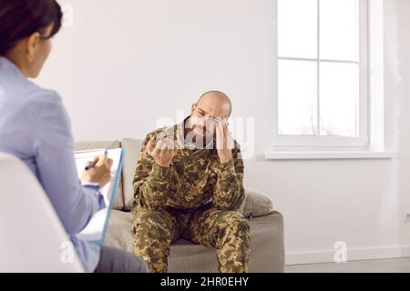 Military person having therapy session. Psychologist consults female ...