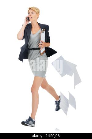 Attractive businesswoman running with papers in hand Stock Photo - Alamy