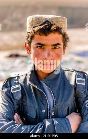 A young boy at an Afghan market in Tarin Kot, Afghanistan Stock Photo ...